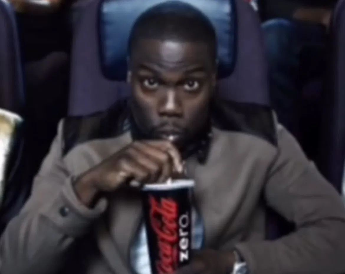 Kevin hart drinking a soda